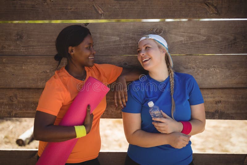 Friends Interacting with Each Other after Workout during Obstacle ...