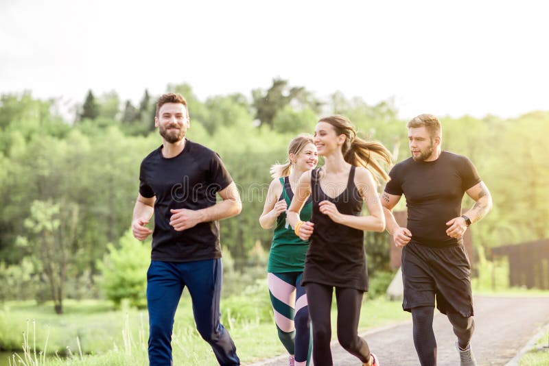 Friends jogging outdoors stock photo. Image of runners - 116894048
