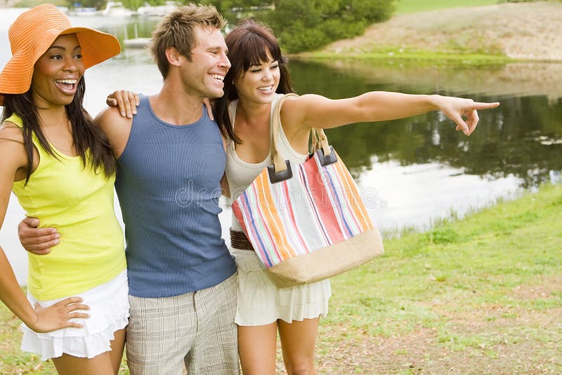 Friends at the lake stock photo. Image of suit, dock - 10048600