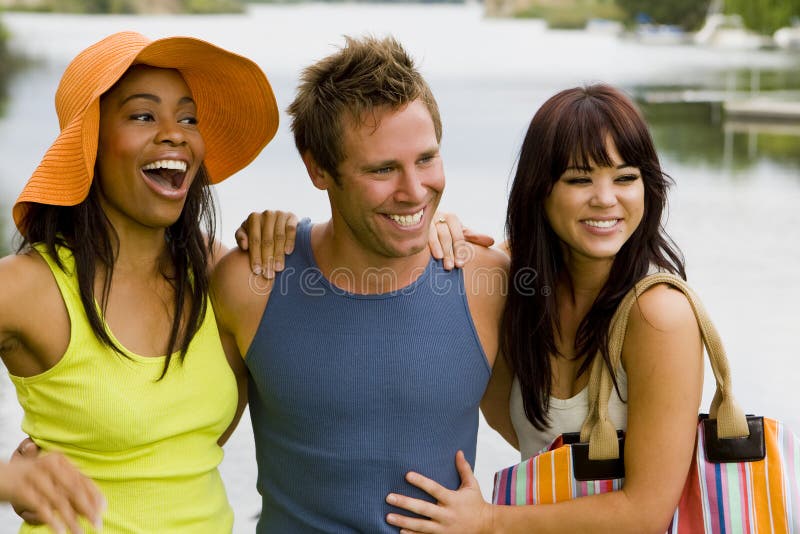 Friends at the lake stock image. Image of ocean, body - 10408271