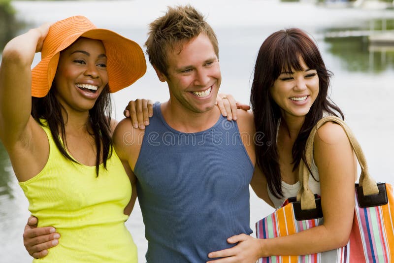 Friends at the lake stock image. Image of skin, beautiful - 9876783