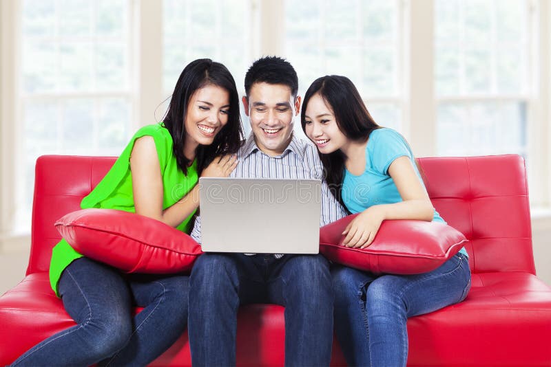 Friends with laptop stock photo. Image of japanese, indian - 33564254