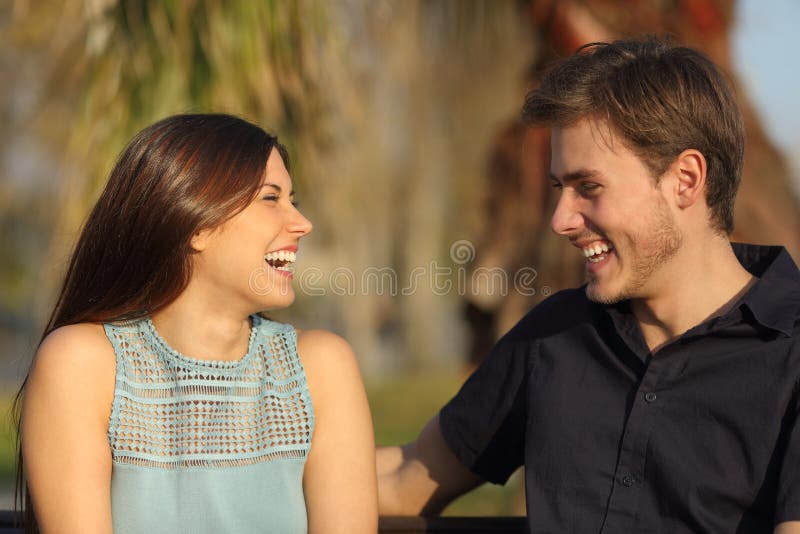 Friends Laughing and Taking a Conversation in a Park Stock Photo ...