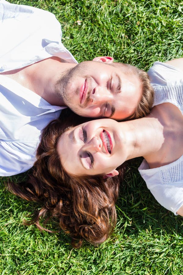 Friends Laying Side by Side on Park Stock Image - Image of summer ...