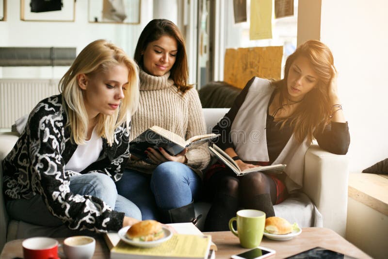 Students Learning in a Cafe. Stock Image - Image of conversation, books ...