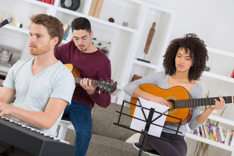 Friends Learning To Play Music Instrument Stock Photo - Image of people ...