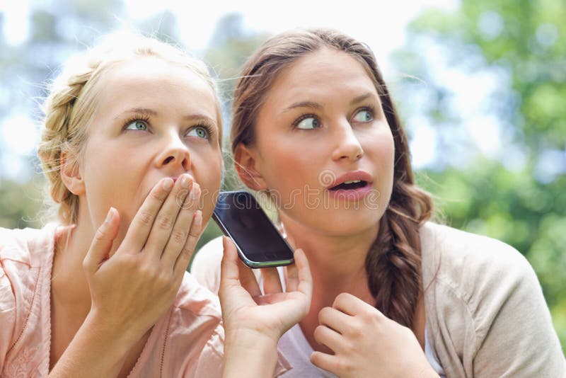 Friends Listening To a Phone Call Stock Image - Image of lifestyle ...