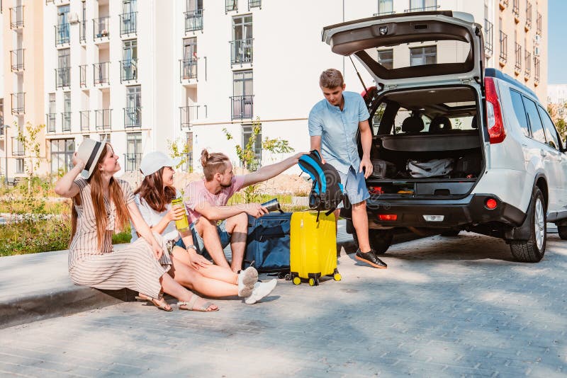 Friends Load Car Trunk with Baggage Stock Image - Image of friends ...