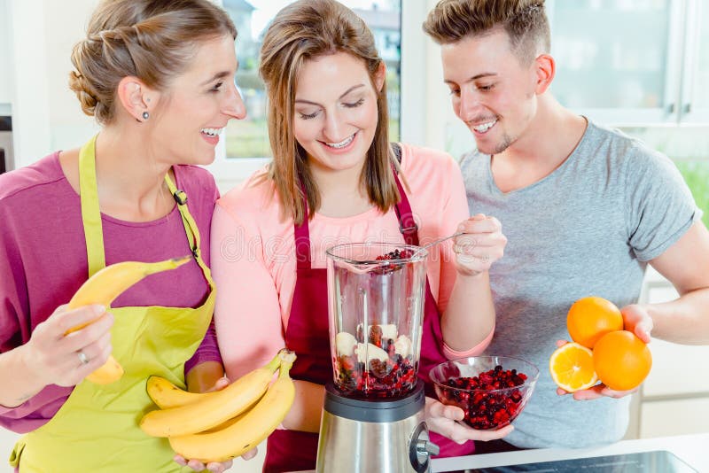 Friends Looking at Fresh Fruits in the Juicer Stock Photo - Image of ...