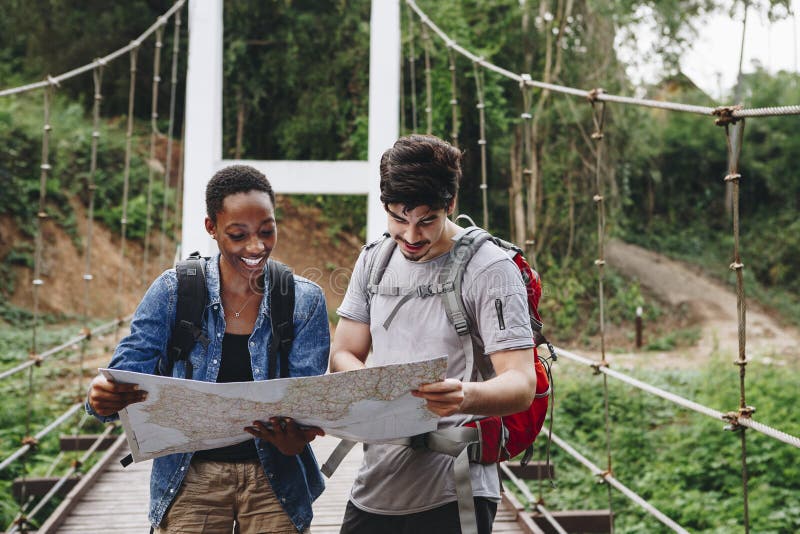 Friends Looking at a Map Traveling Outdoor Stock Image - Image of park ...