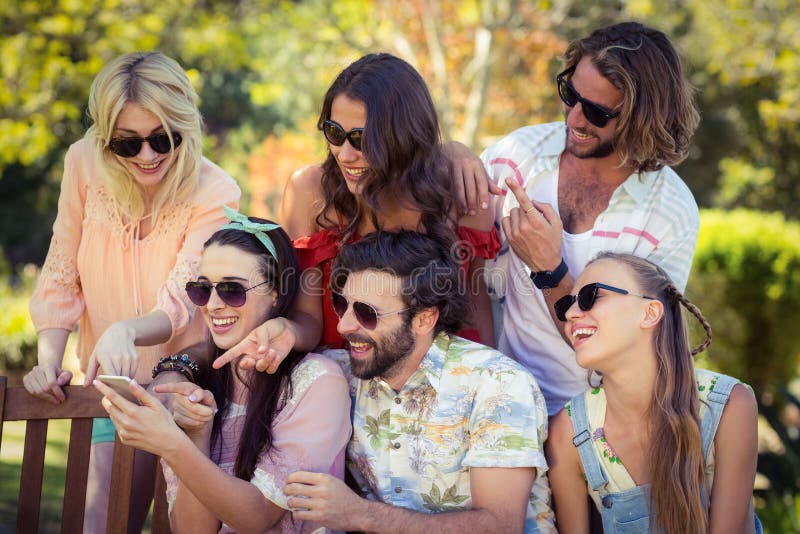Friends Looking at Mobile Phone Stock Image - Image of looking ...
