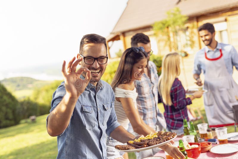 Friends making barbecue stock image. Image of eating - 142436549