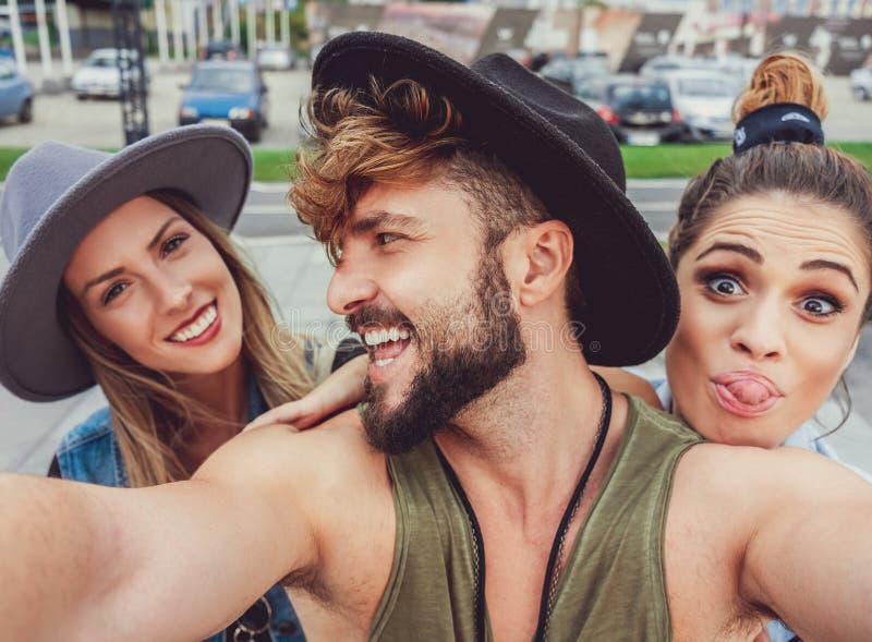 Friends Making Faces while Taking Selfie Stock Image - Image of phone ...