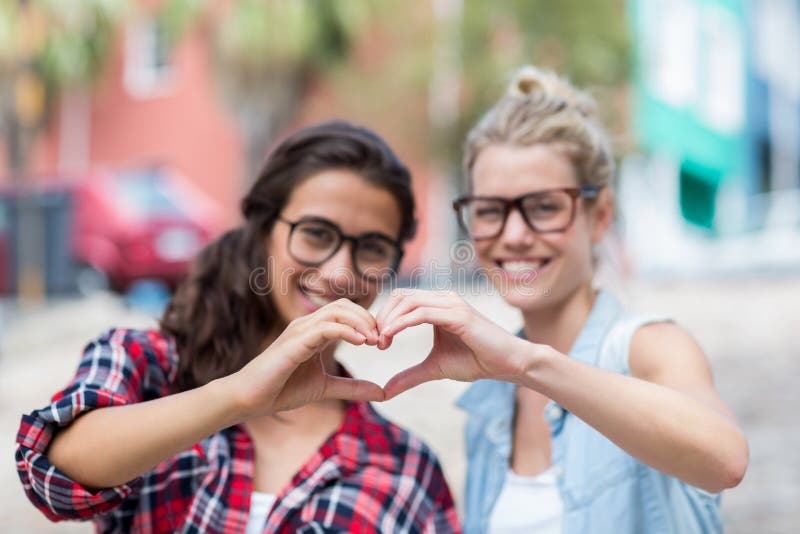 Friends Making Heart Shape with Hands Stock Image - Image of camera ...
