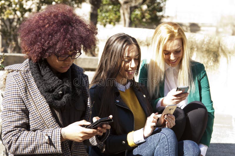 Friends with mobile phone stock photo. Image of girls - 67864660