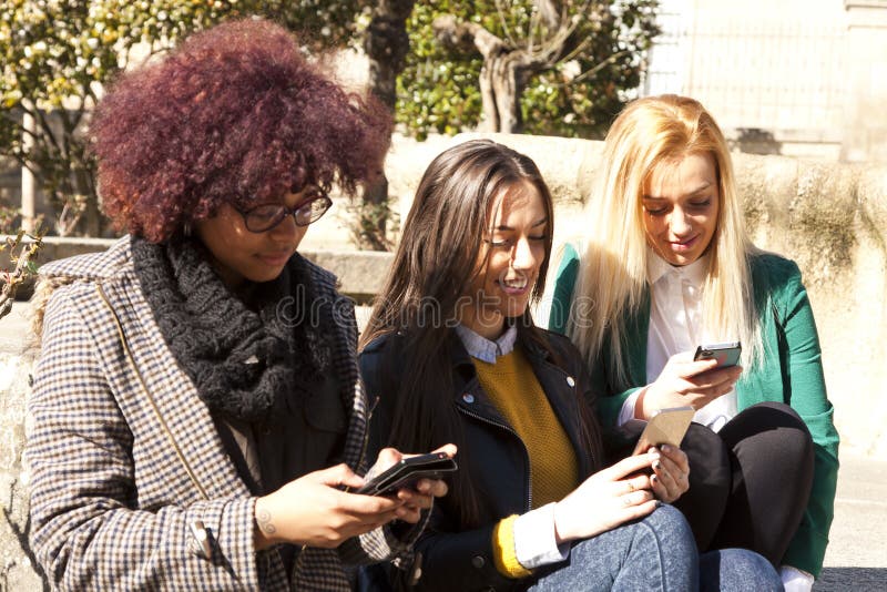 Friends with mobile phone stock photo. Image of caucasian - 68533250