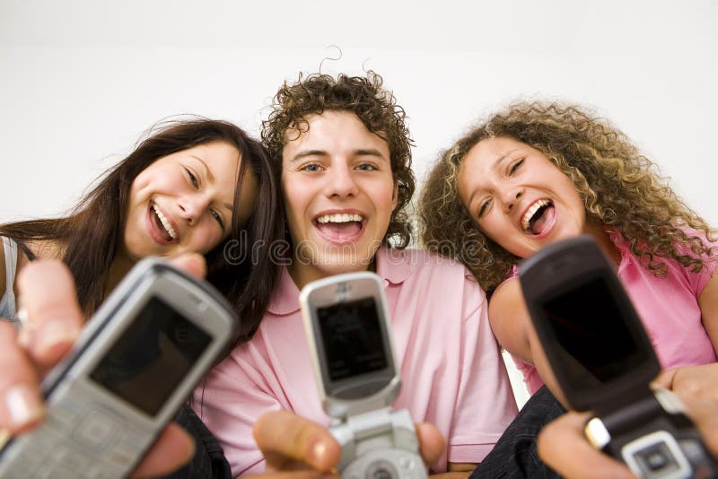 Friends with mobile phones stock photo. Image of indoor - 5407848