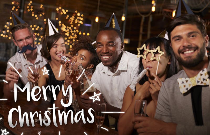 Friends at the Bar during a Christmas Party Look To Camera Stock Image ...