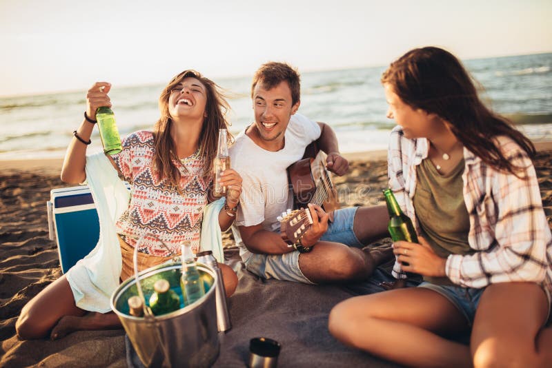 Friends Partying on the Beach with Drinks Stock Image - Image of ...