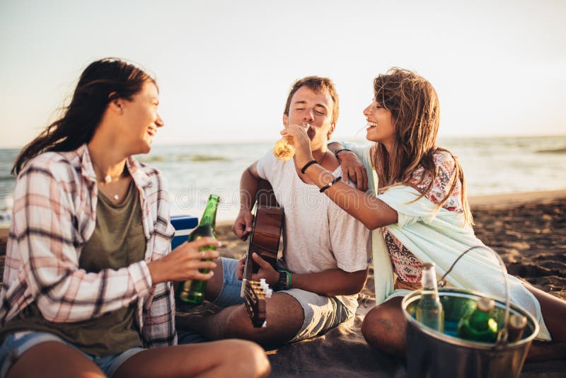 Friends Partying on the Beach with Drinks Stock Image - Image of party ...