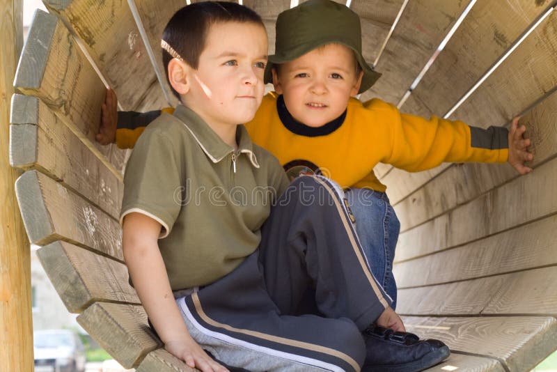 Two Little Friends Playing Together in Playground. Stock Image - Image ...