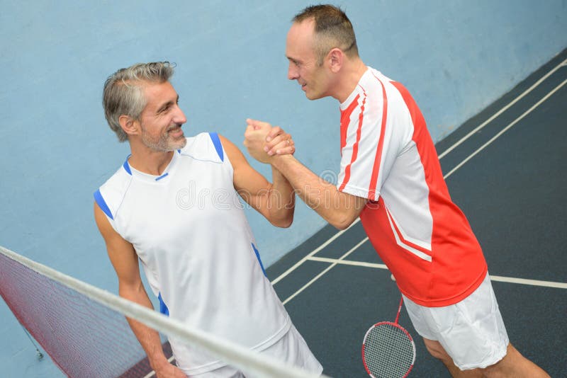 Friends playing badminton stock image. Image of play - 174511189