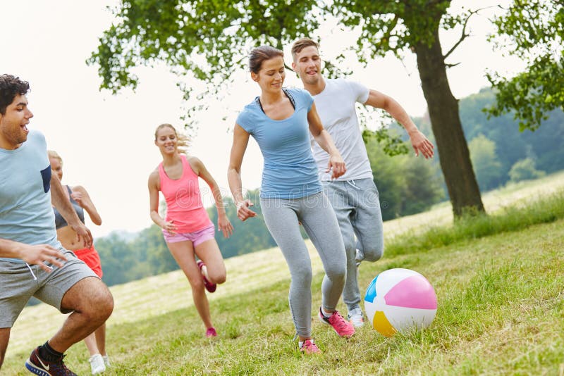Friends Playing with Ball in Movement Stock Image - Image of nature ...
