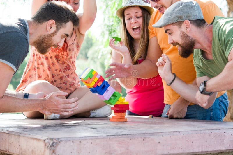Friends playing block game stock photo. Image of people - 97738932