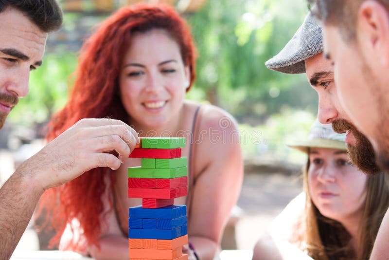 Friends playing block game stock photo. Image of people - 97738932