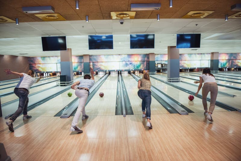 Friends playing bowling stock photo. Image of laugh - 298882658