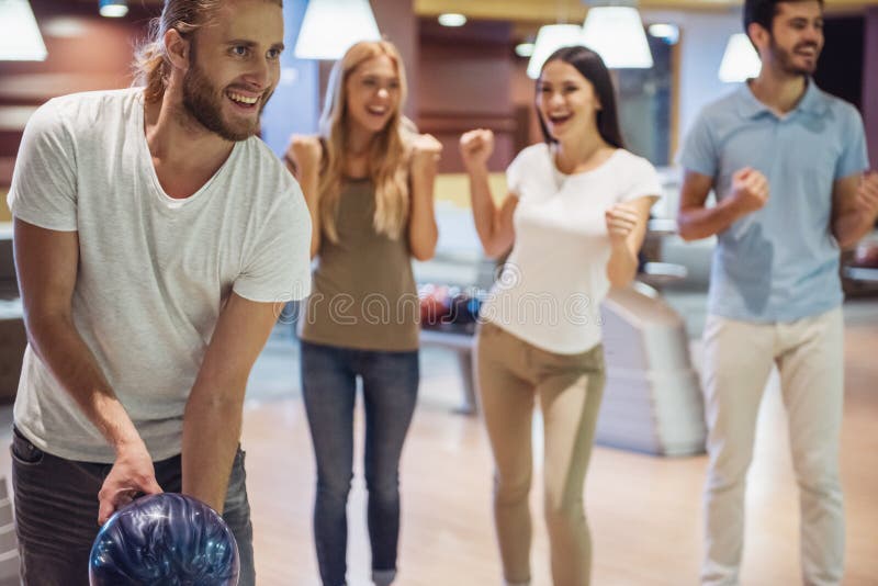 Friends playing bowling stock photo. Image of competition - 298882678