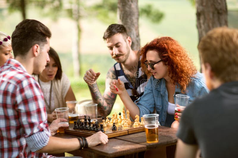 Friends Playing Chess and Drinks Beer Stock Photo - Image of horizontal ...