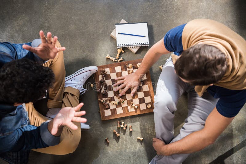 Friends playing chess stock image. Image of knowledge - 93100057