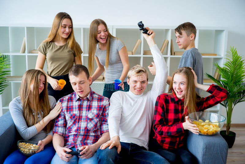 Friends Playing a Console Game Stock Photo - Image of friends, couch ...