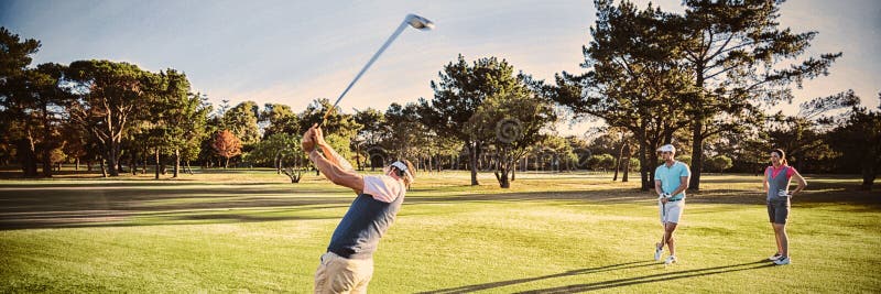 Friends Playing Golf on Field Stock Image - Image of enjoyment, pursuit ...