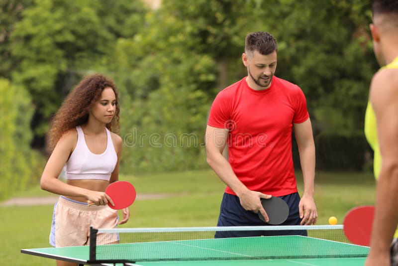 Friends Playing Ping Pong Outdoors on Summer Day Stock Image - Image of ...