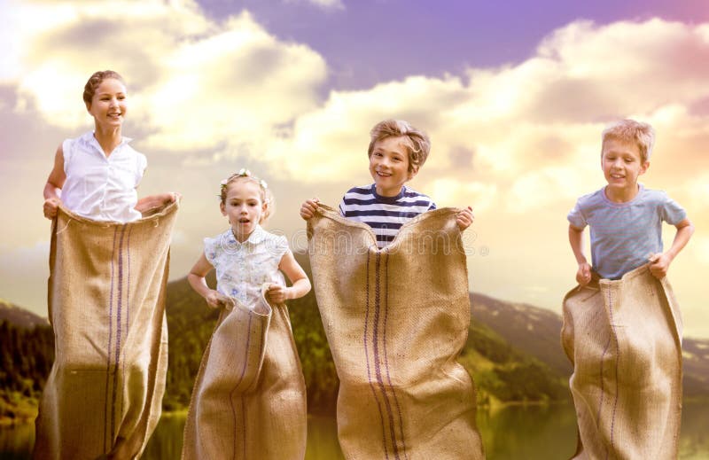 Composite Image of Friends Playing Sack Race Stock Image - Image of ...