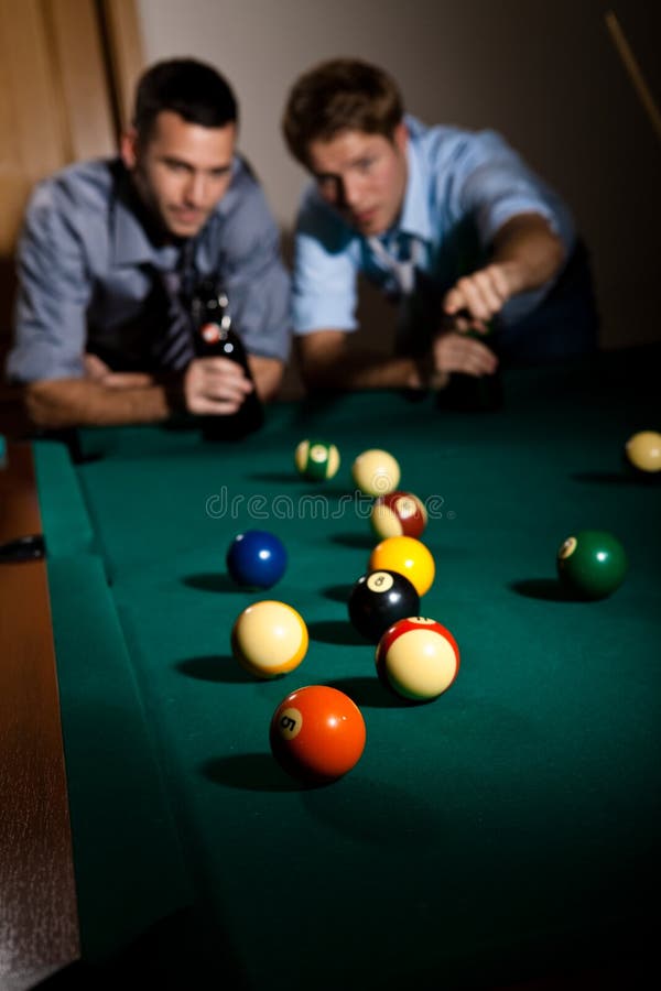 Friends playing snooker stock image. Image of joyful - 24850371