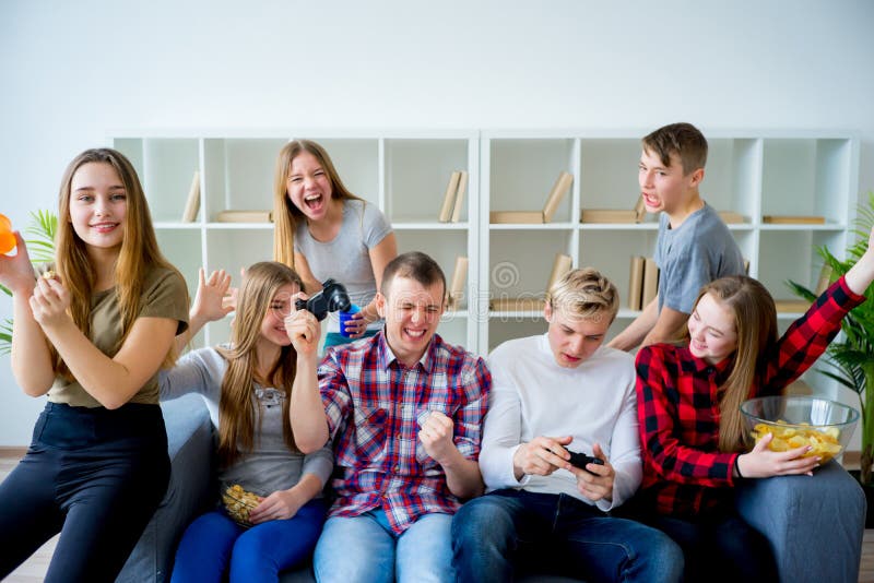Friends playing an xbox stock image. Image of nintendo - 90364725