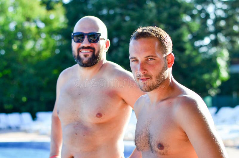 Friends on pool stock image. Image of male, healthy, eyes - 99768765