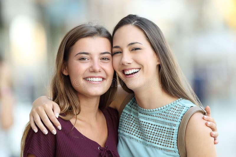 Friends Posing with Perfect Smiles on the Street Stock Photo - Image of ...