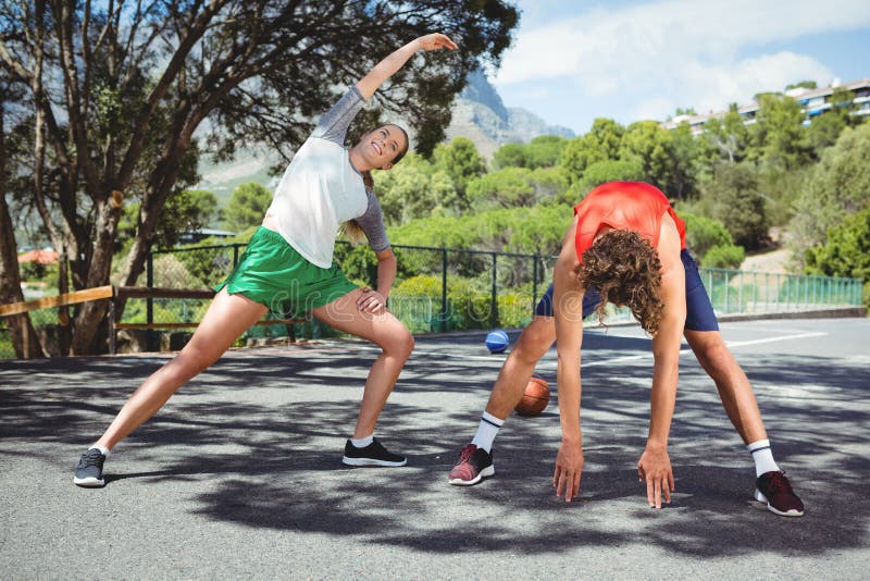 Friends Practicing Stretching Exercise on Road Stock Image - Image of ...