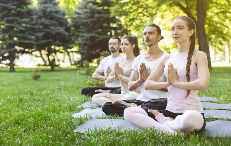 Friends Practicing Yoga in Park Making the Gesture of Namaste Stock ...