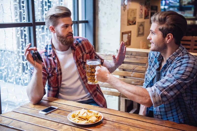 Friends at the pub stock photo. Image of alcoholism - 291405962