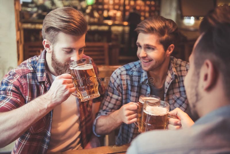Friends at the pub stock photo. Image of clinking, leisure - 85654804