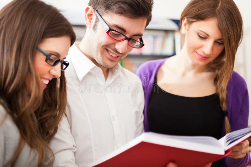 Friends reading a book stock photo. Image of bookstore - 30128730