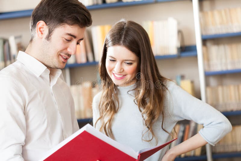 Friends reading a book stock image. Image of male, library - 30128809
