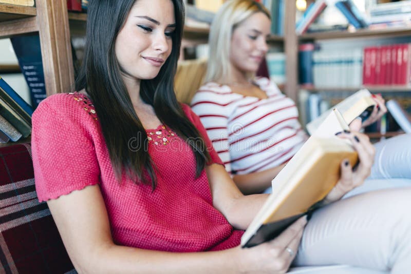Friends reading books stock photo. Image of caucasian - 64776650