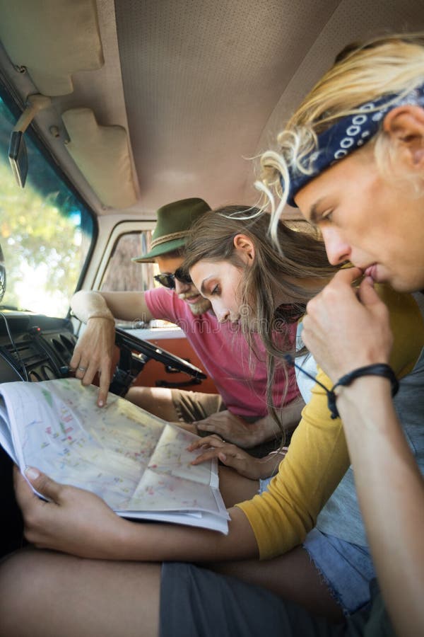 Friends Reading Map in Camper Van Stock Photo - Image of caucasian ...