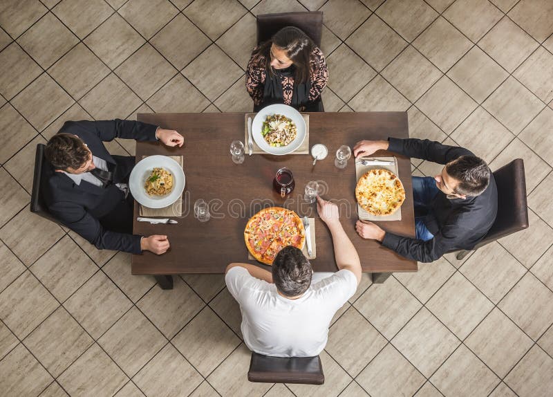 Top View of a Table with Italian Food and Friends Eating and Drinking ...